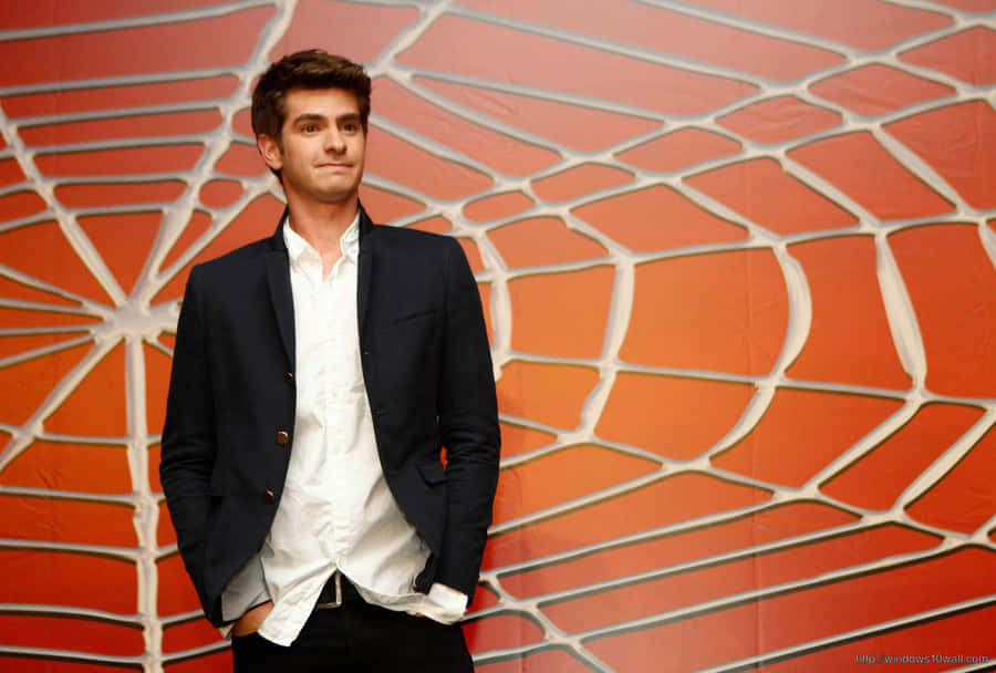 A Man In A Suit Standing In Front Of A Spider Web Wallpaper | WallpapersOK